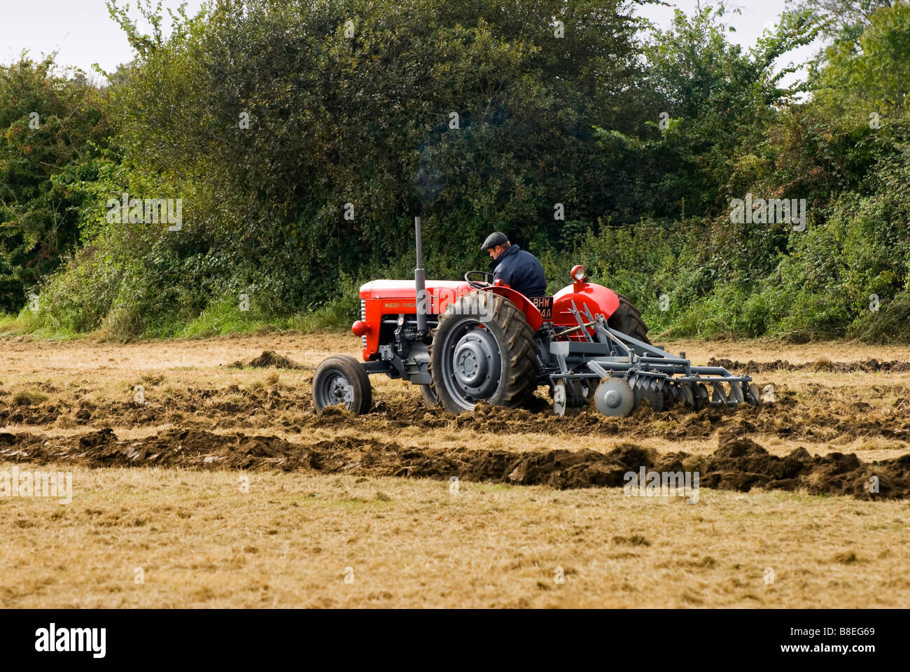 Tractor enthusiast in renovated 1963 Massey Ferguson 65 tractor ...