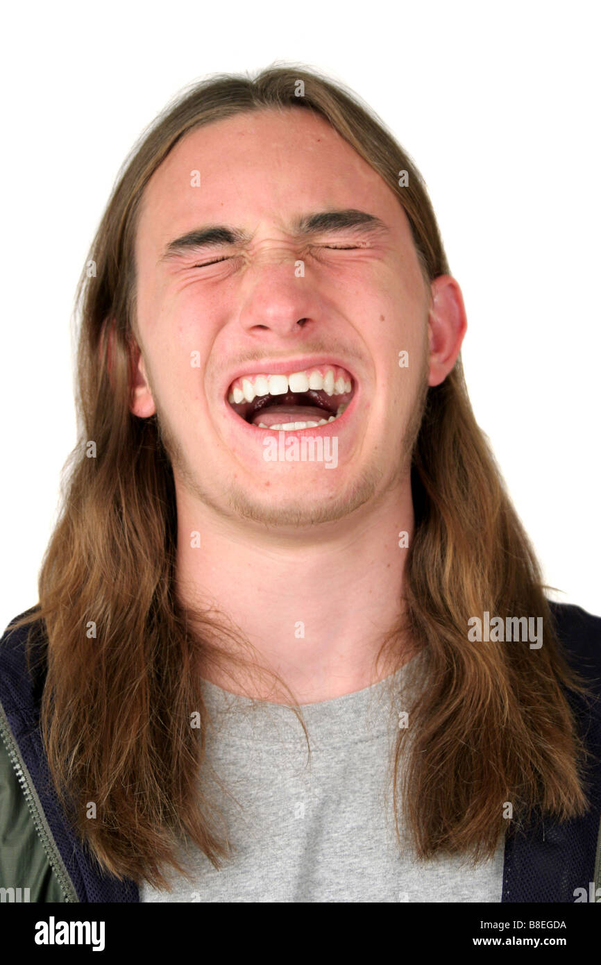 teen boy grimacing in agony Stock Photo - Alamy