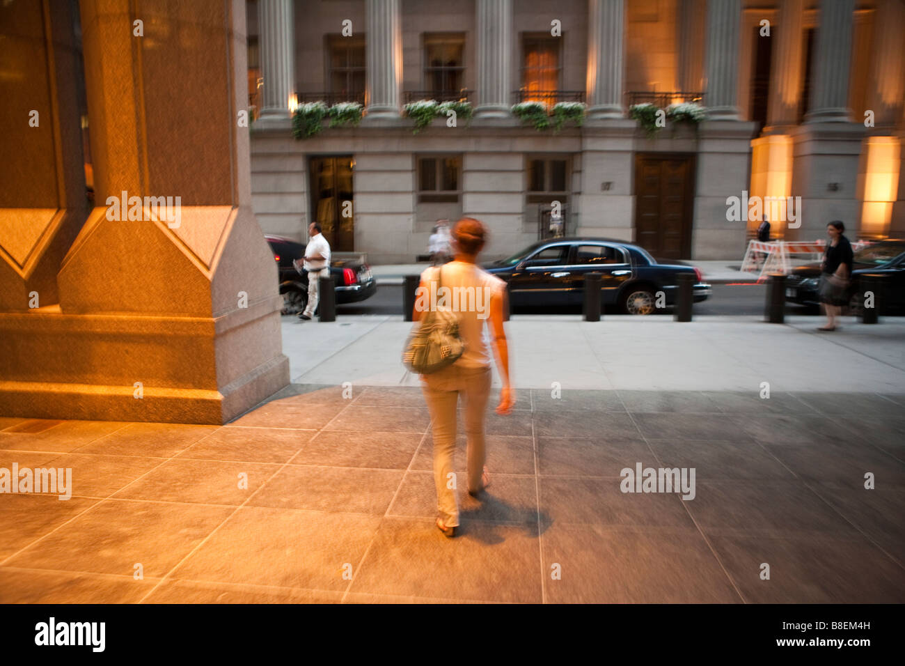 Business woman walking out office building hi-res stock photography and ...