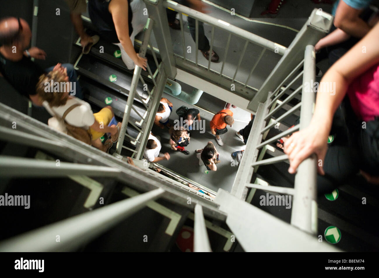 Crowd of people walking up stairs Stock Photo - Alamy