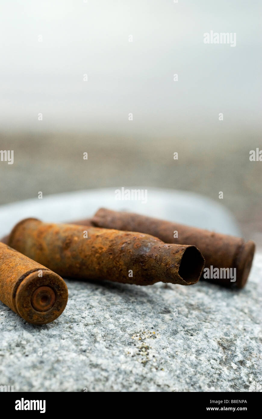 Three rusty bullet shells Stock Photo - Alamy
