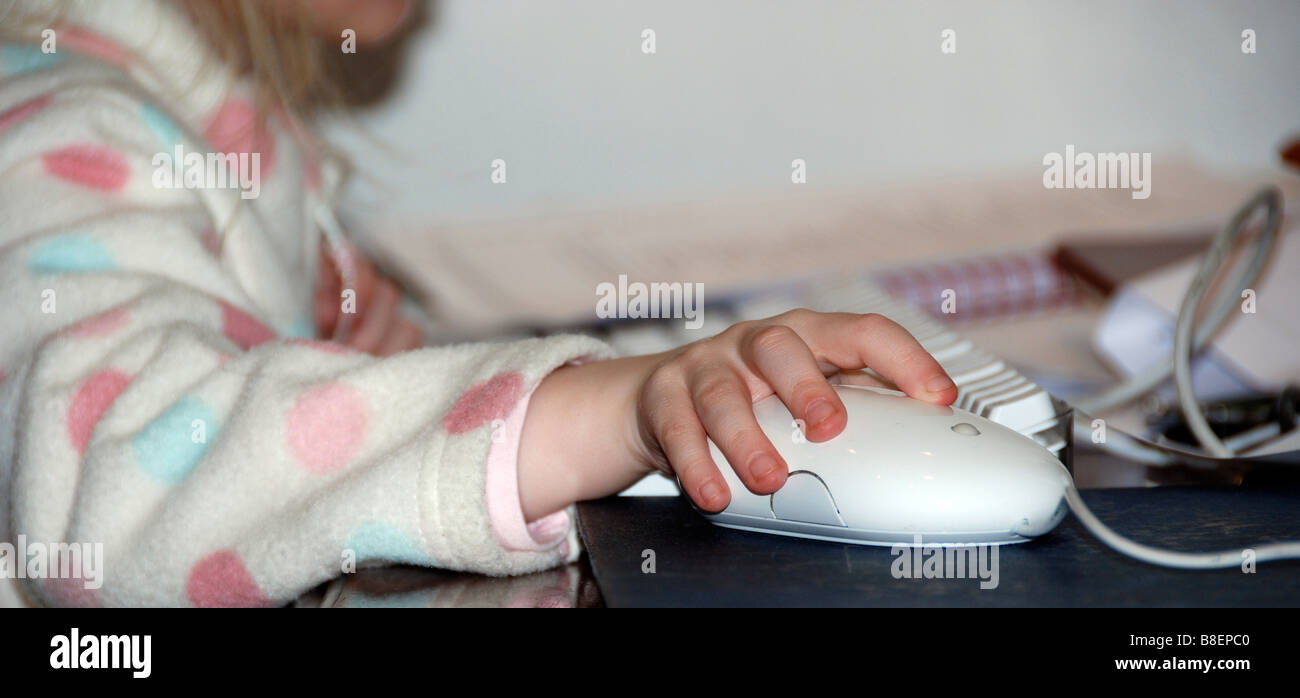 young child's hand on macintosh computer mouse Stock Photo - Alamy