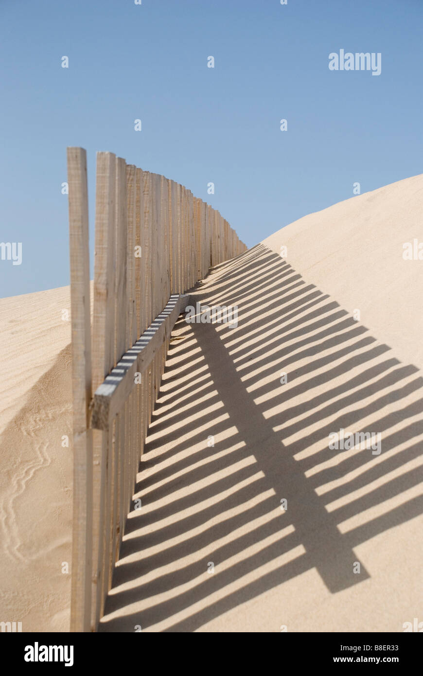 dune with a wood fence Stock Photo - Alamy