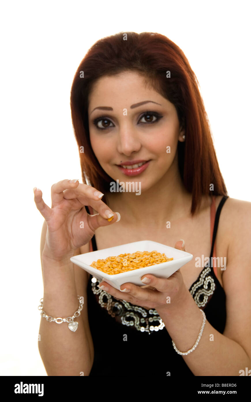 middle eastern woman with a plate of yellow split peas Stock Photo - Alamy