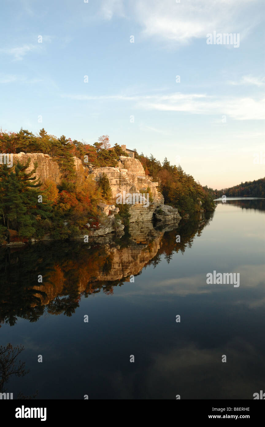Sunset illuminating the cliffs along Lake Minnewaska in Minnewaska ...
