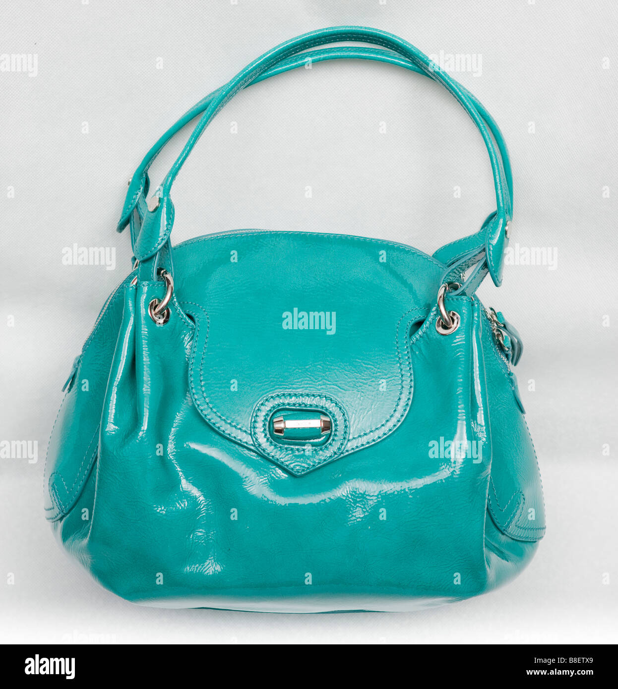A Woman s turquoise Handbag Isolated On White Background Stock Photo ...
