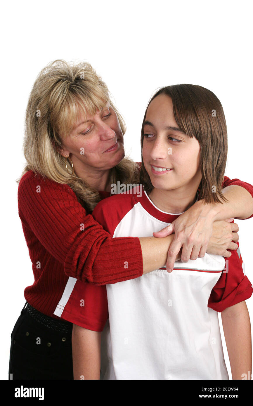 A mother trying to give her skeptical son a hug Isolated Stock Photo ...
