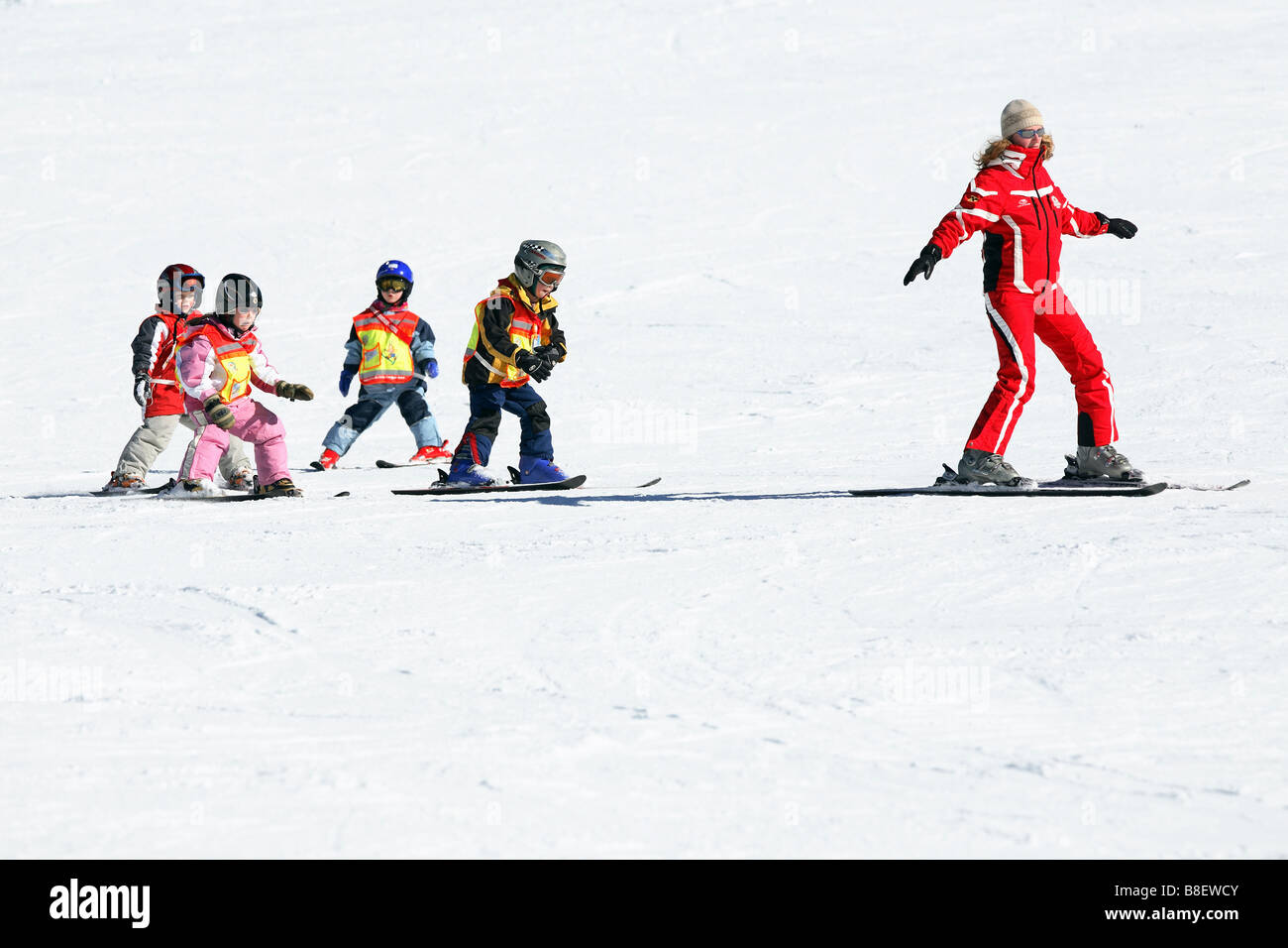 Kids learning skiing Stock Photo - Alamy