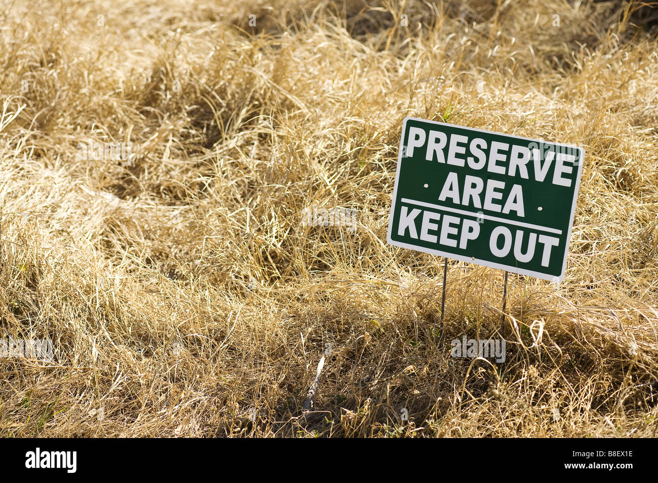 keep out sign in brown grass preserve area Stock Photo - Alamy