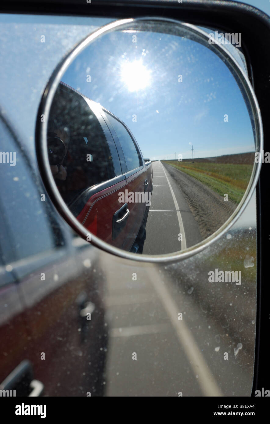 Distored reflection in moving truck mirror Stock Photo - Alamy