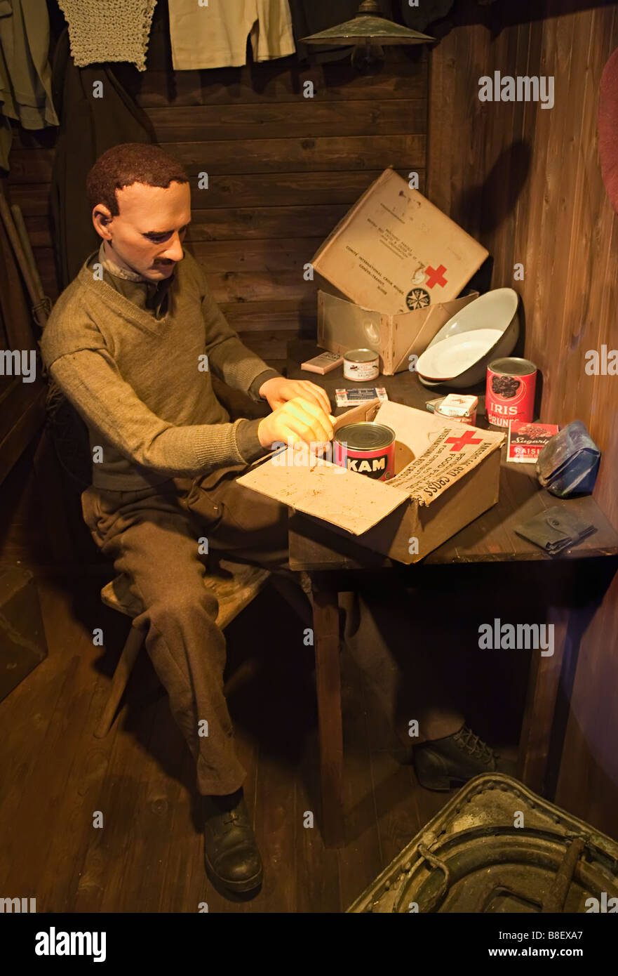 Museum model of Second World War prisoner of war soldier opening a Red ...
