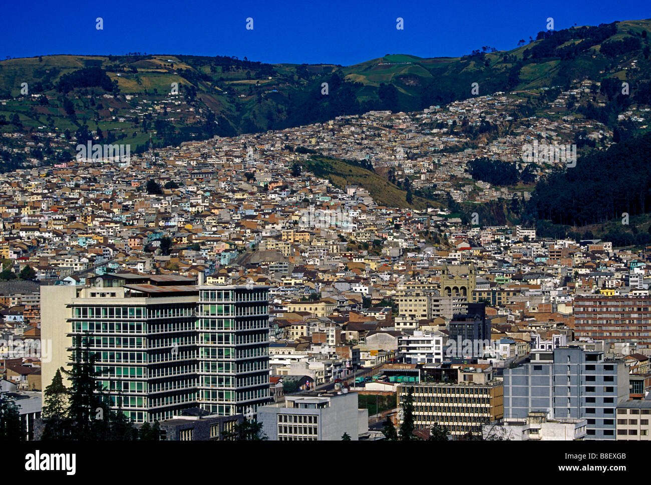 view from above cityscape of capital city of Quito surrounded by Andes ...