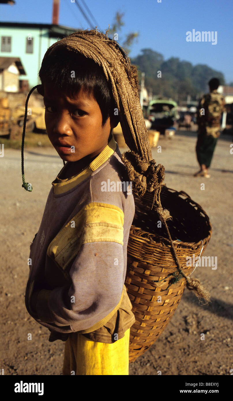 Young Burman boy carrying a heavy basket, Kalaw, Union of Myanmar Stock ...