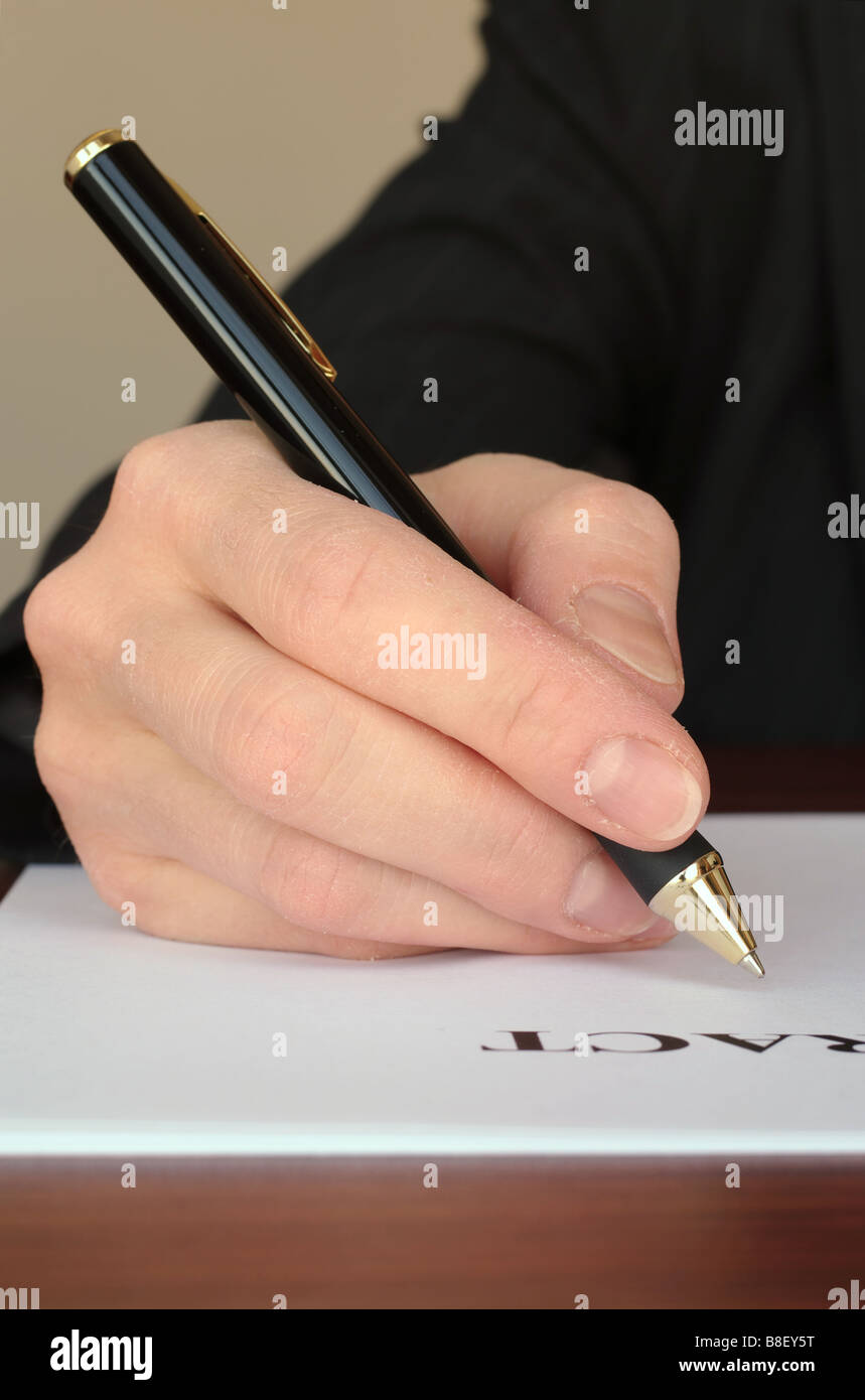 Woman s hand signing on a contract Stock Photo - Alamy