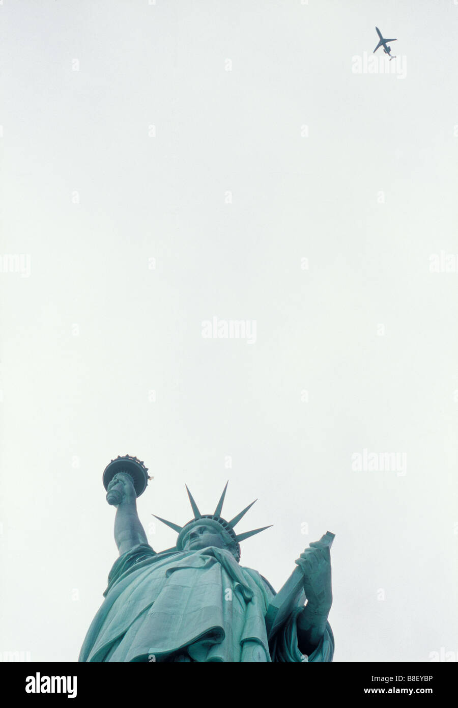 Statue of Liberty with Plane in Sky Stock Photo - Alamy