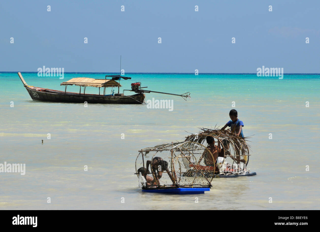 Moken kids enjoy playing with thier small boat,Surin Island,Phangnga ...