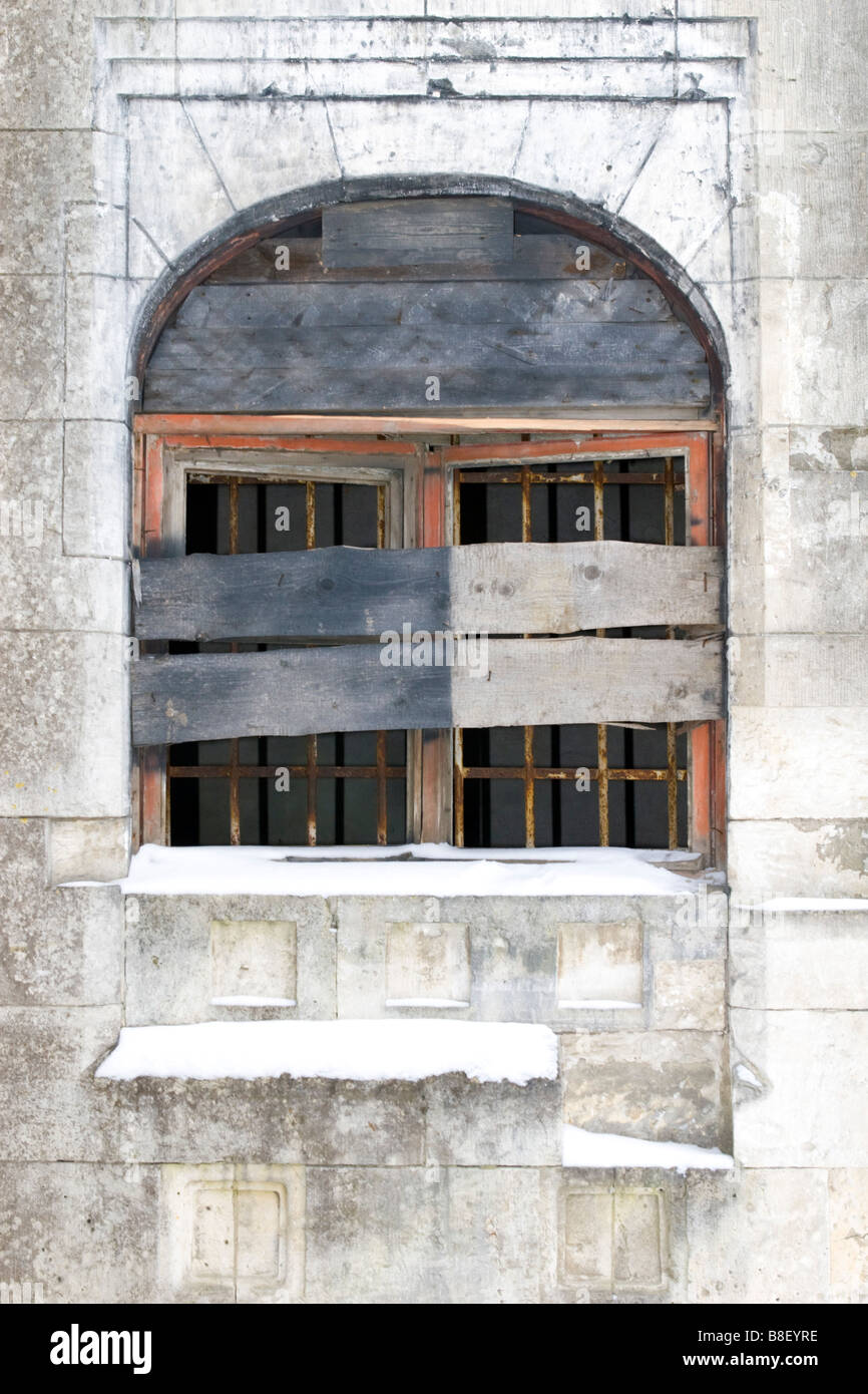 Old building window frame blocked up with wooden boards Stock Photo - Alamy