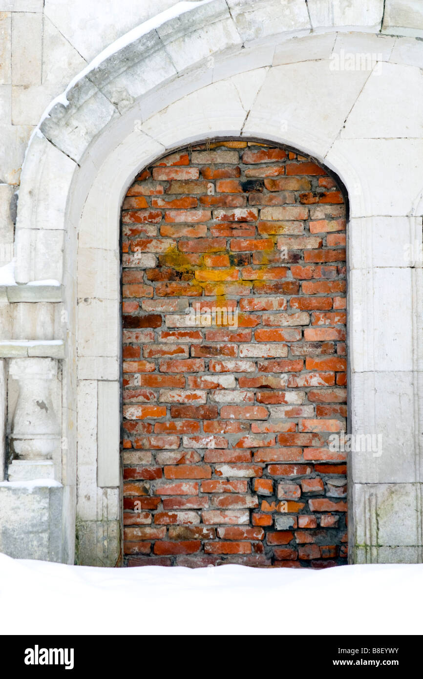 Old building door frame piled up with bricks Stock Photo - Alamy