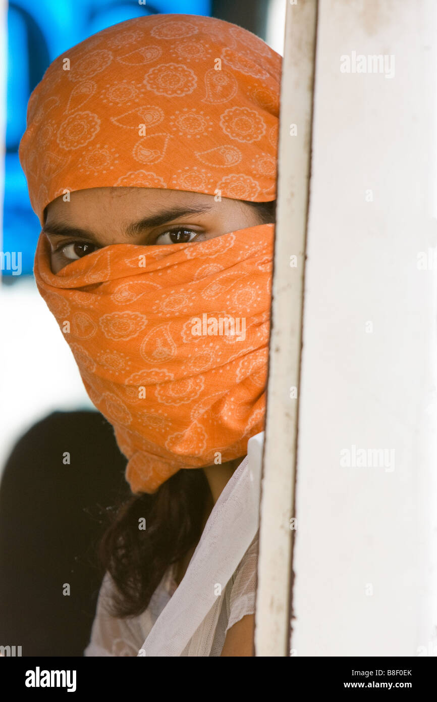 Veiled Muslim Indian girl looking through window of bus, Jaipur, India ...