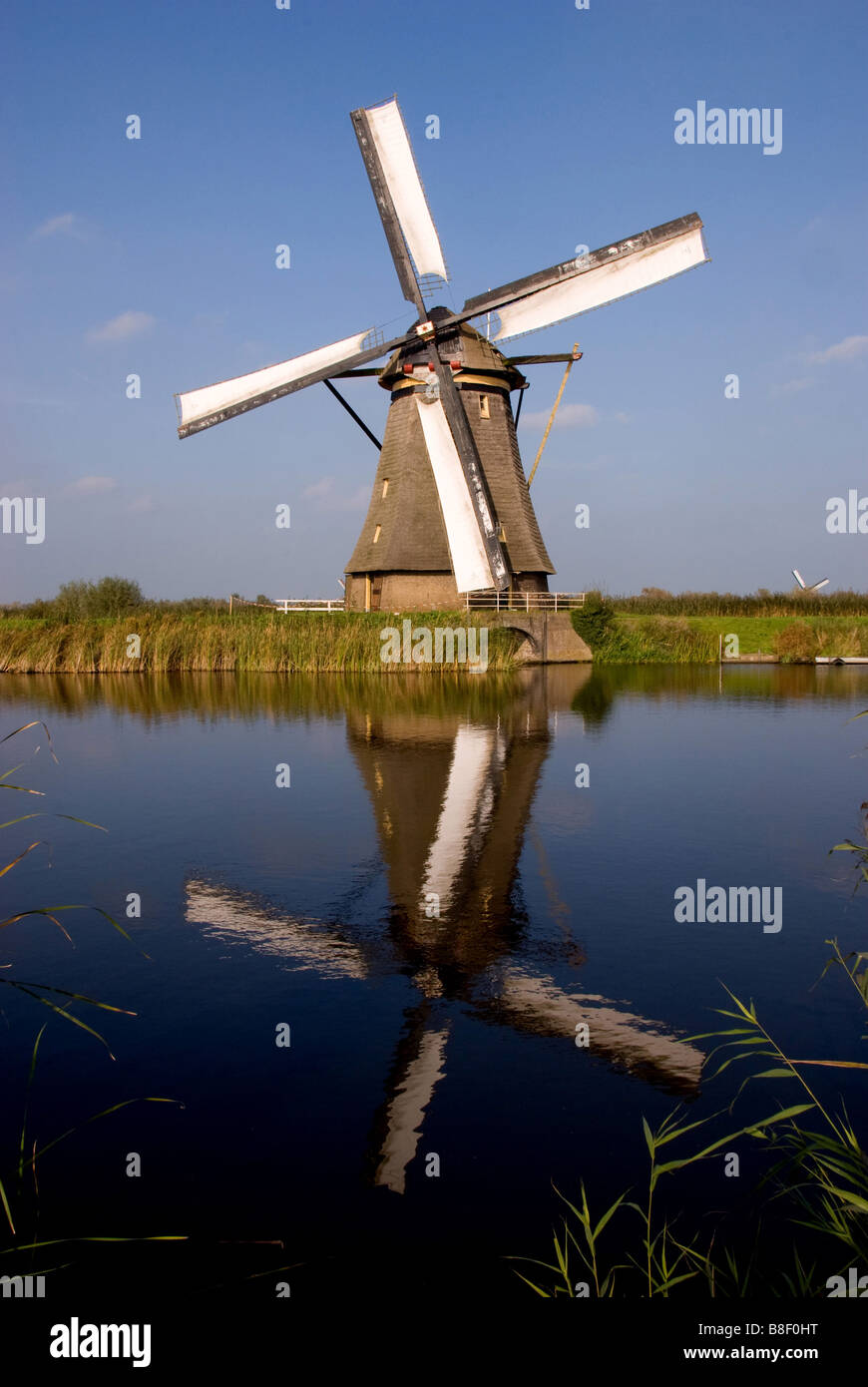 Traditional Dutch Windmill on Blue River Water Stock Photo - Alamy