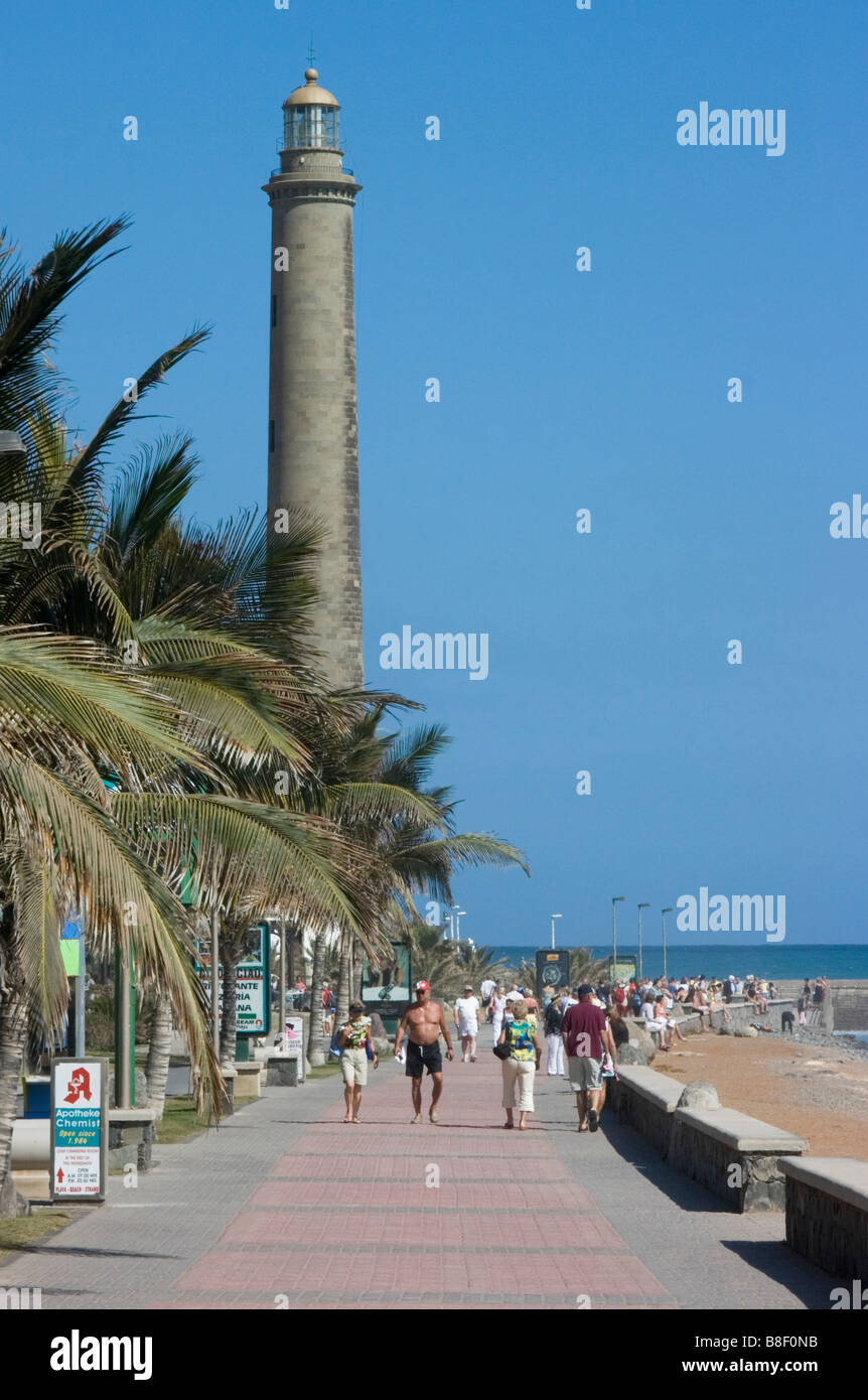 Seafront Promenade with palm trees and lighthouse, Maspalomas, Gran ...