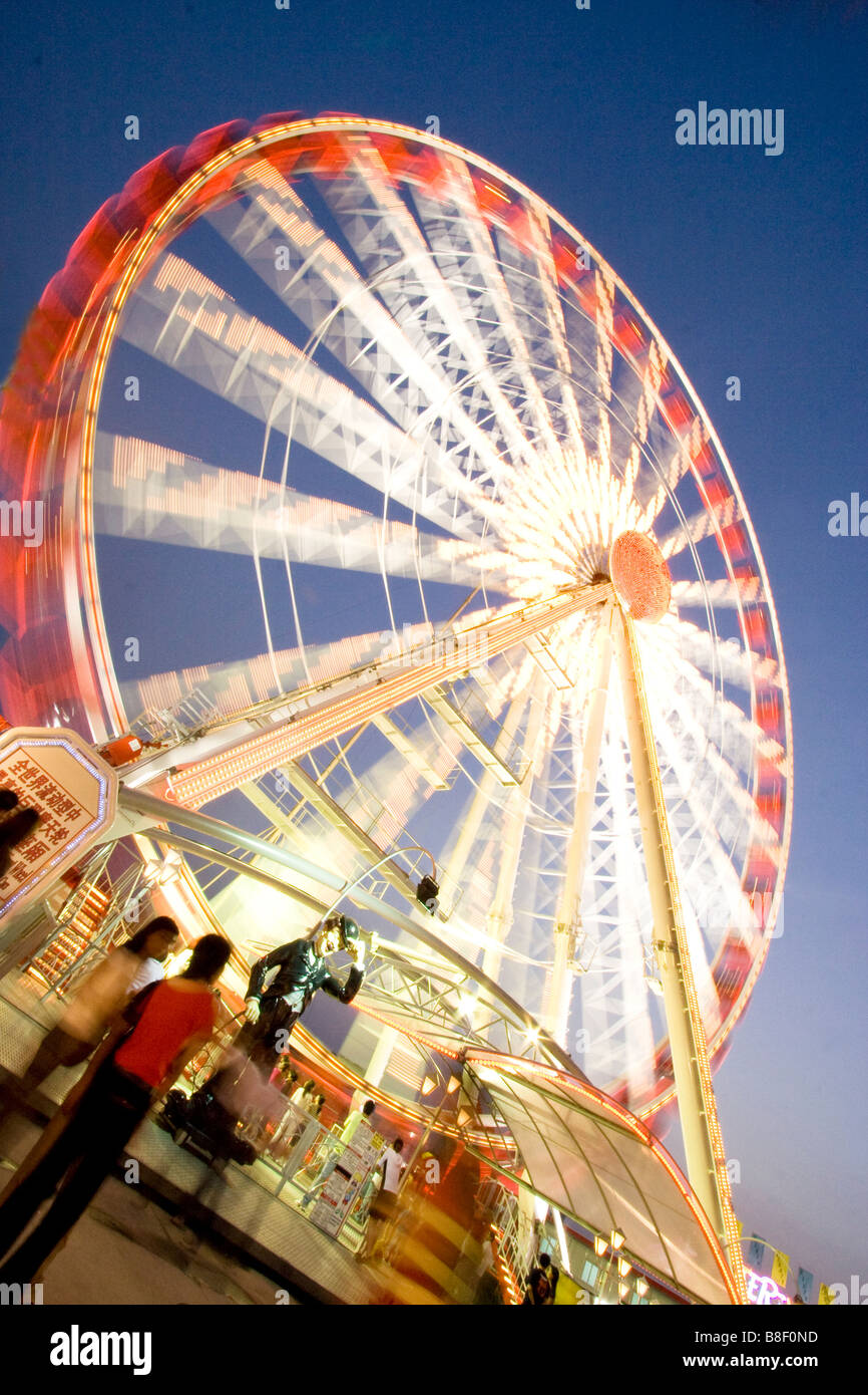 Spinning ferris wheel at a carnival just starting to move Stock Photo ...