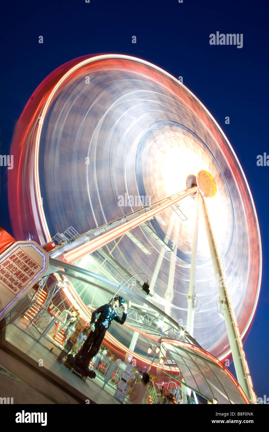 Spinning Ferris wheel at a funfair Stock Photo - Alamy