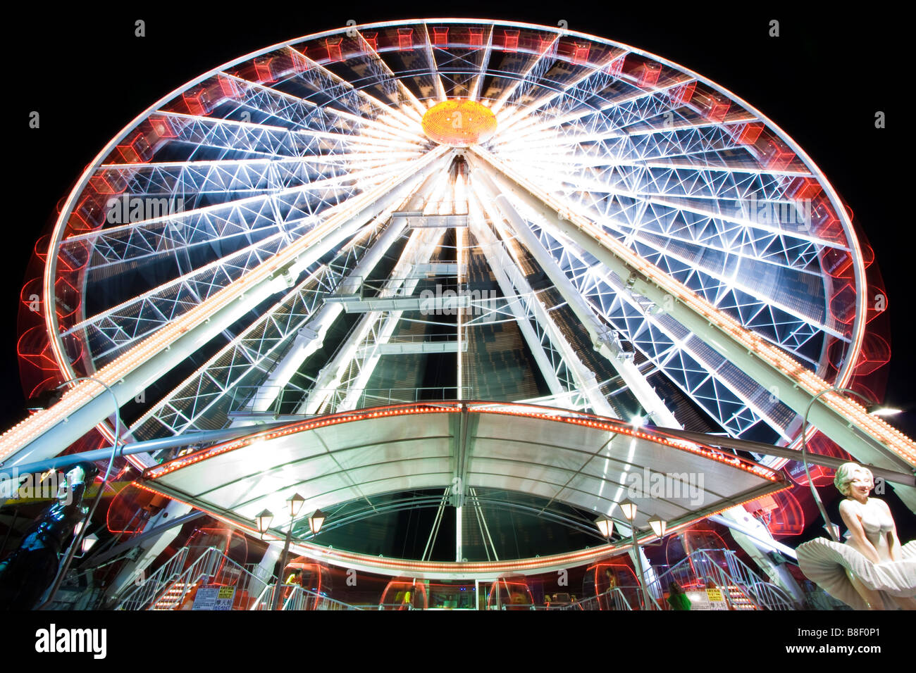 A ferris wheel just starting to spin at an amusement park Stock Photo ...