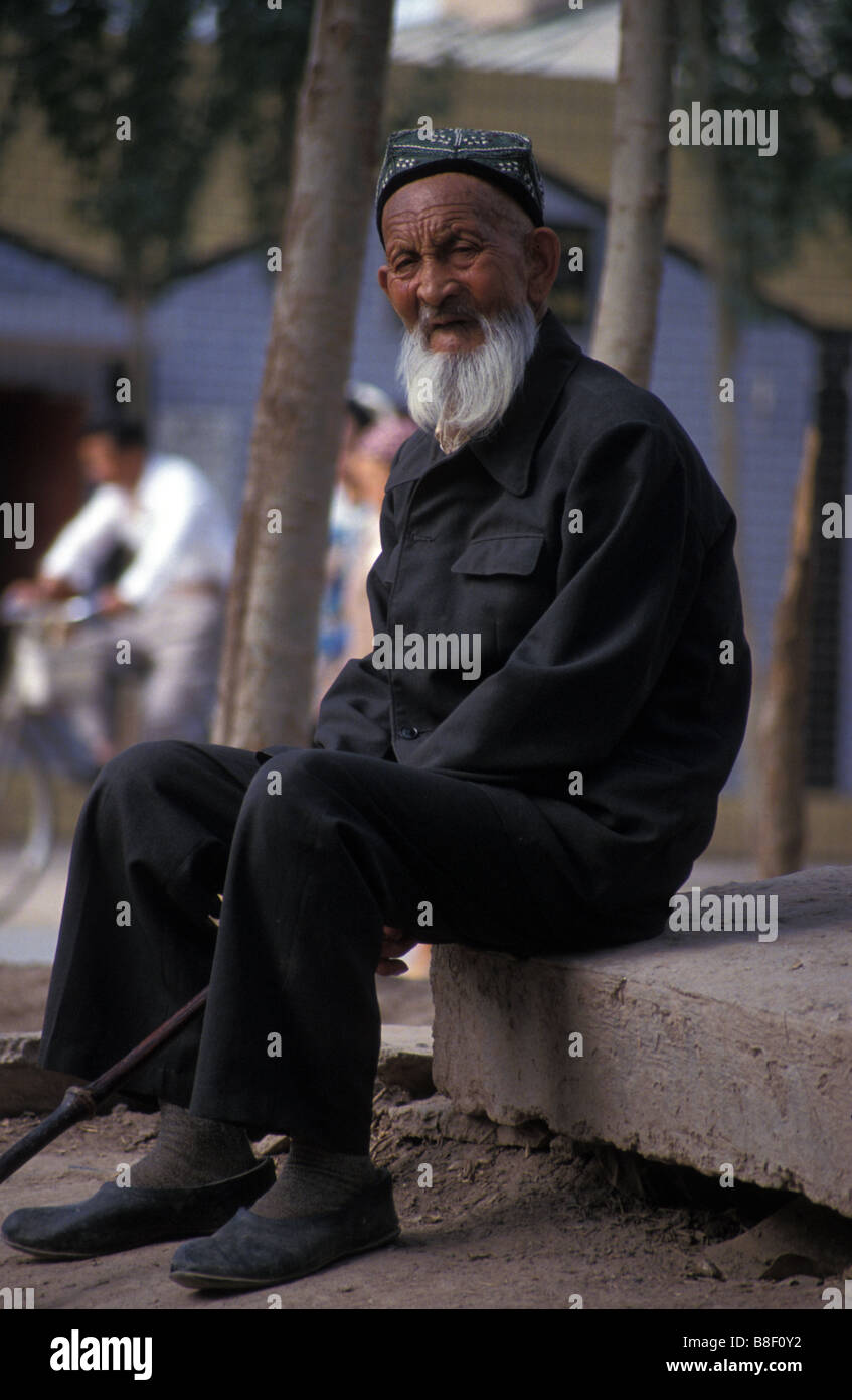 old Uighur man sitting outside mosque Kashgar Xinjiang China Stock ...