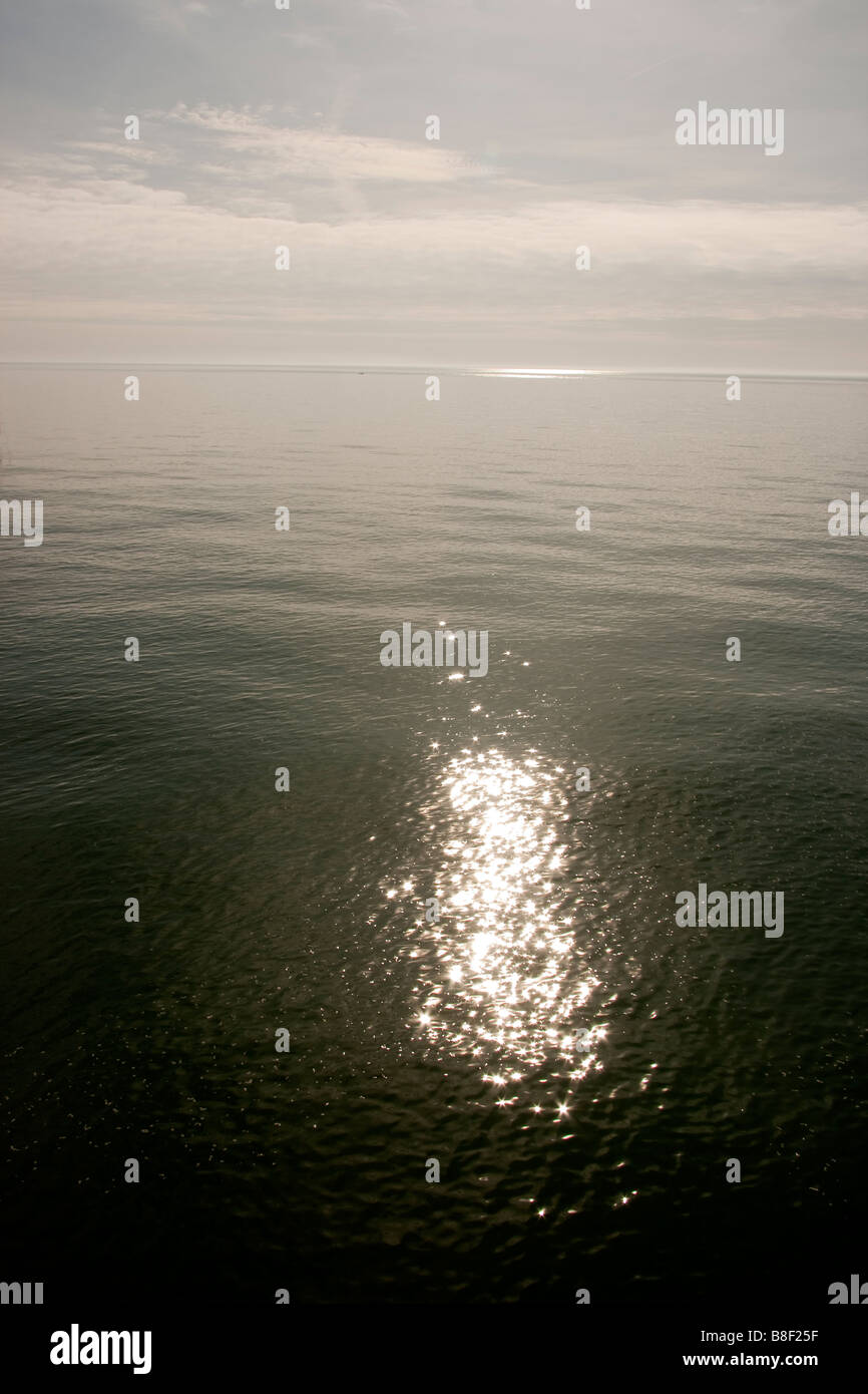 Sun reflected on a calm sea Stock Photo - Alamy