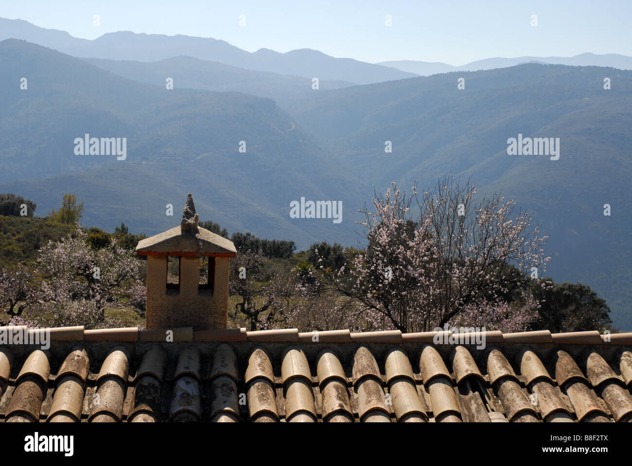 tiled roof, chimney, view to distant mountains, near Benimaurell, Vall ...