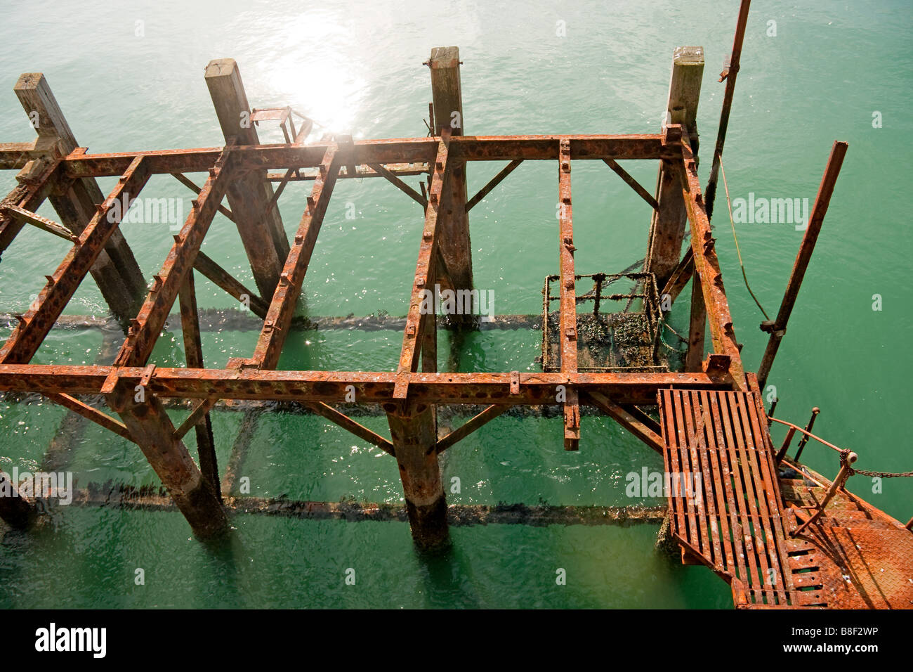 A rusty disused platform on Eastbourne pier Stock Photo - Alamy
