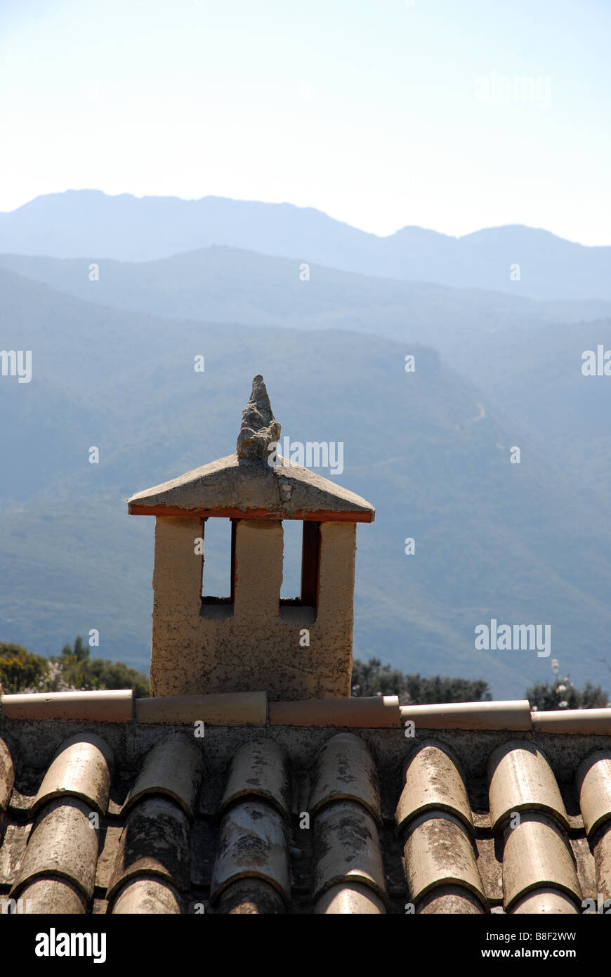 tiled roof, chimney, view to distant mountains, near Benimaurell, Vall ...