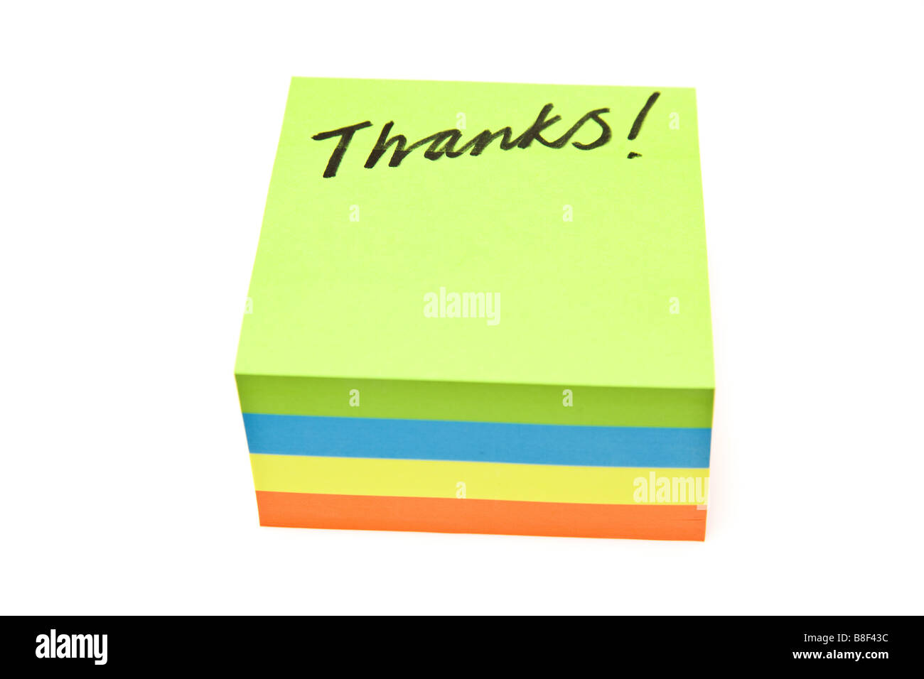 Thanks written on a pad of post it notes isolated on a white studio ...