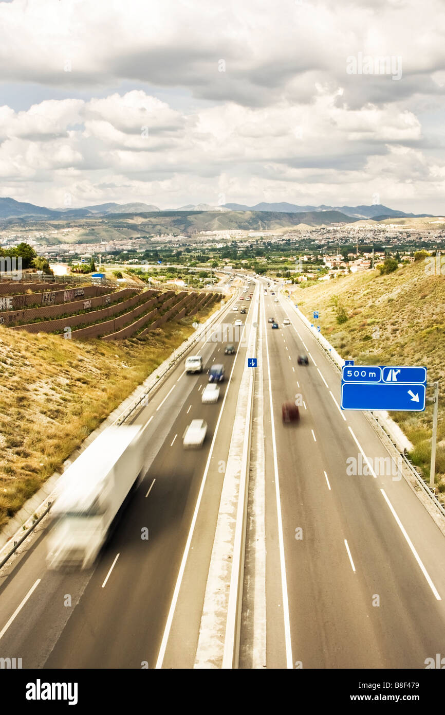 Highway to the city blank blue sign in one side Stock Photo - Alamy