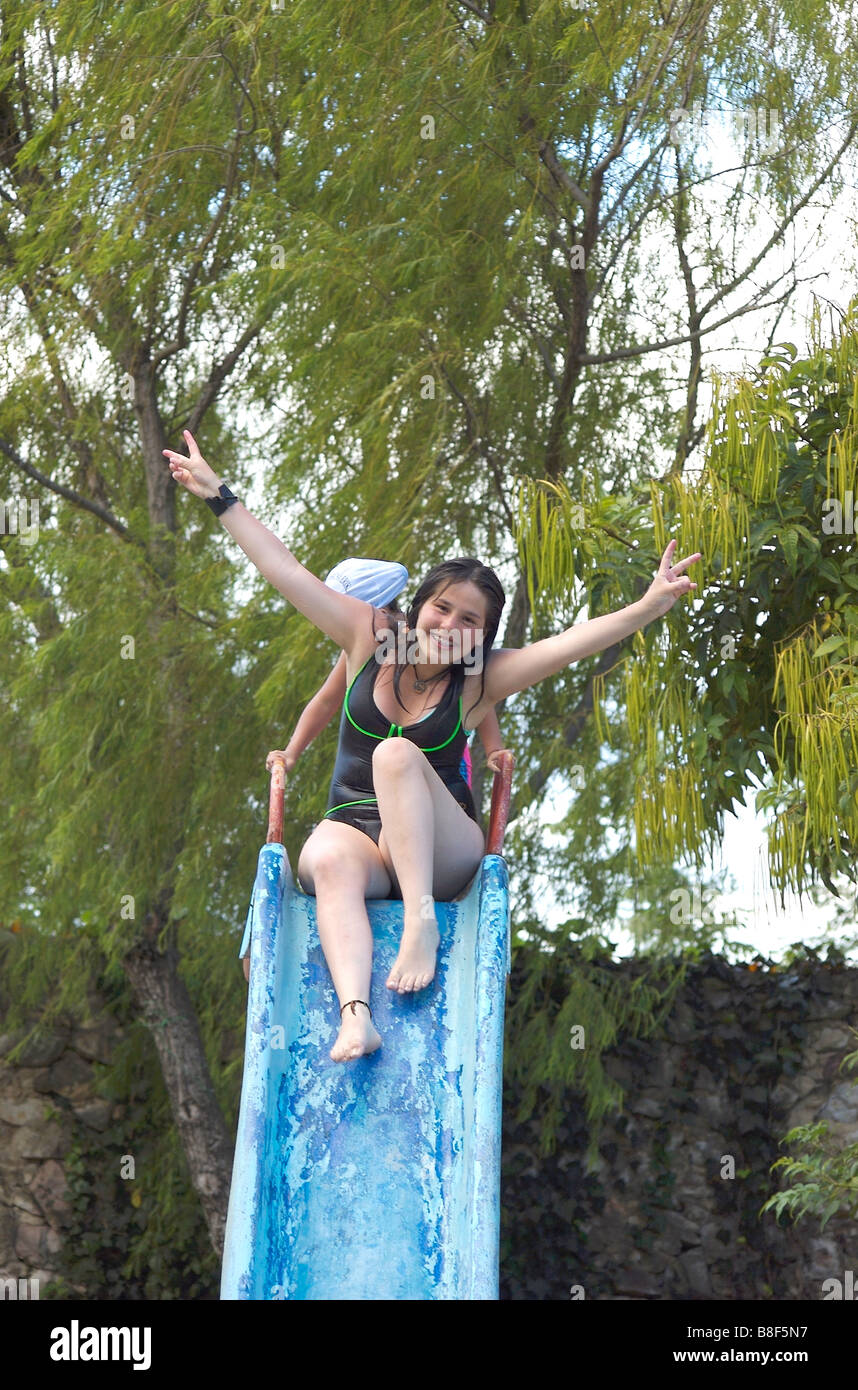 Girl going down a slide hi-res stock photography and images - Alamy