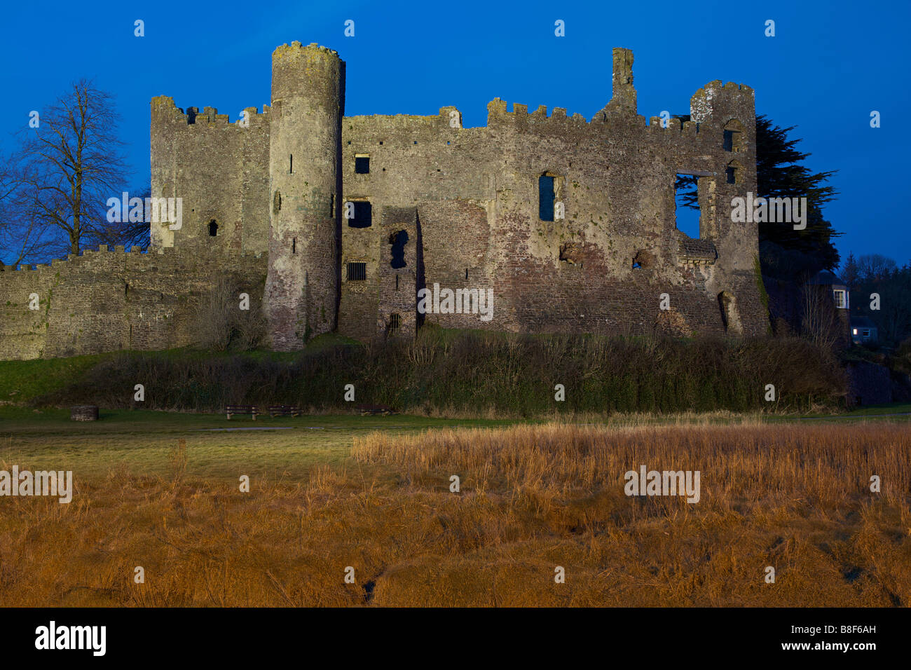 Laugharne castle Wales at dusk Stock Photo - Alamy