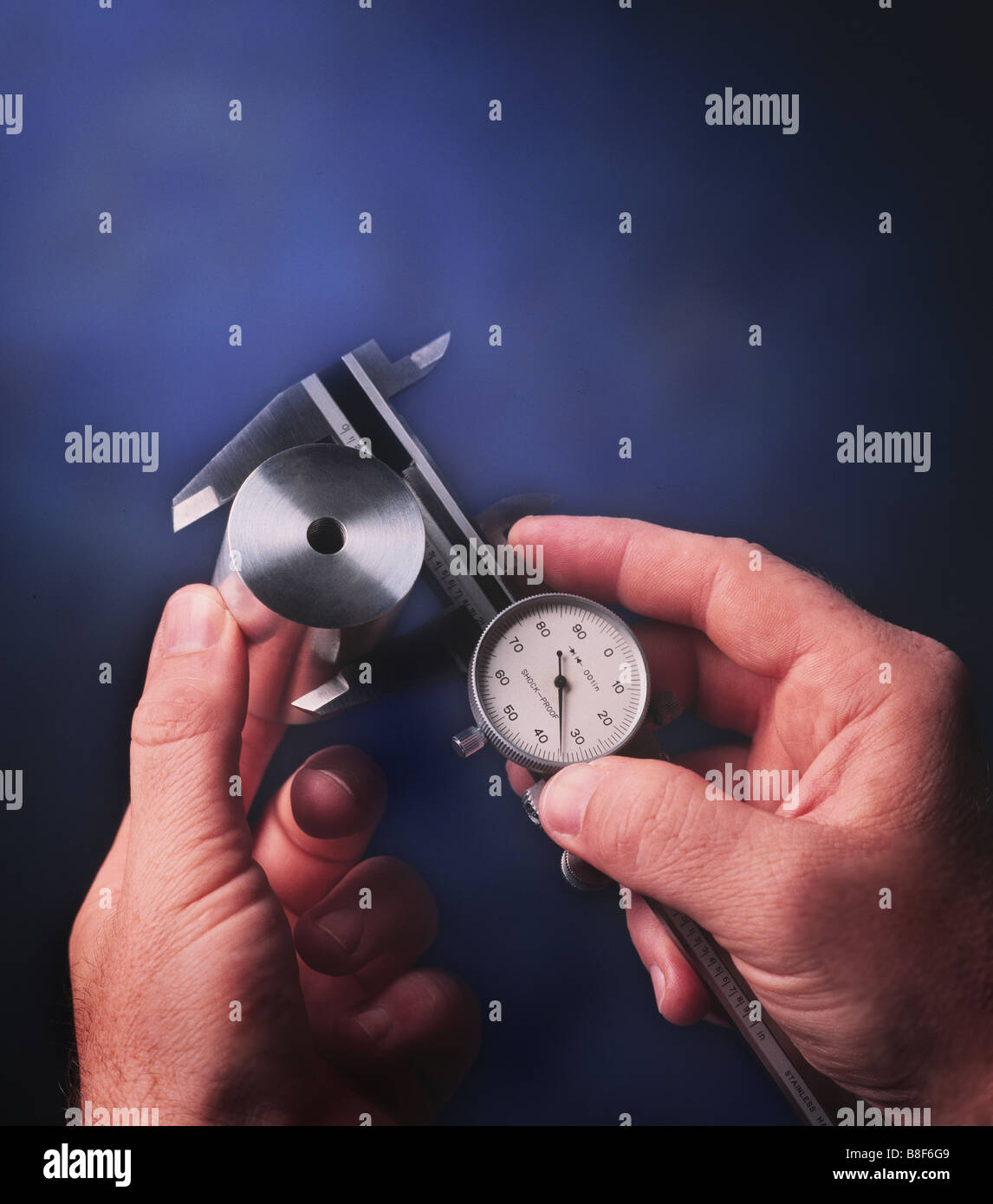 Measuring the diameter of a piece of roll steel Stock Photo - Alamy