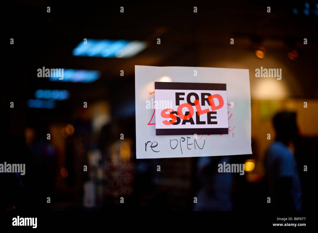 Sold sign on a window of a store Stock Photo - Alamy