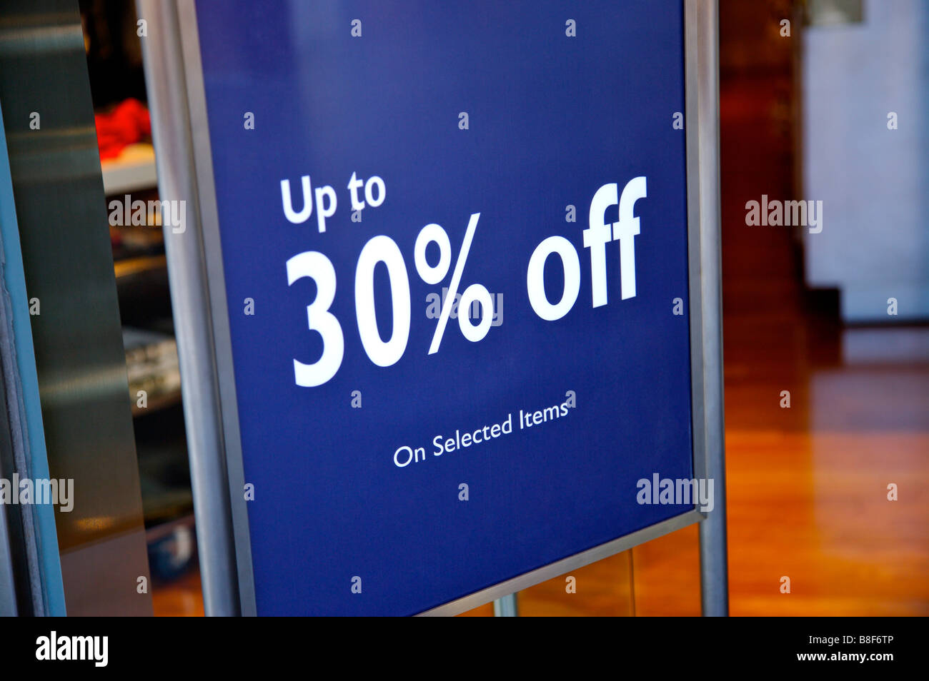 Blue and white discount sign in a store Stock Photo - Alamy