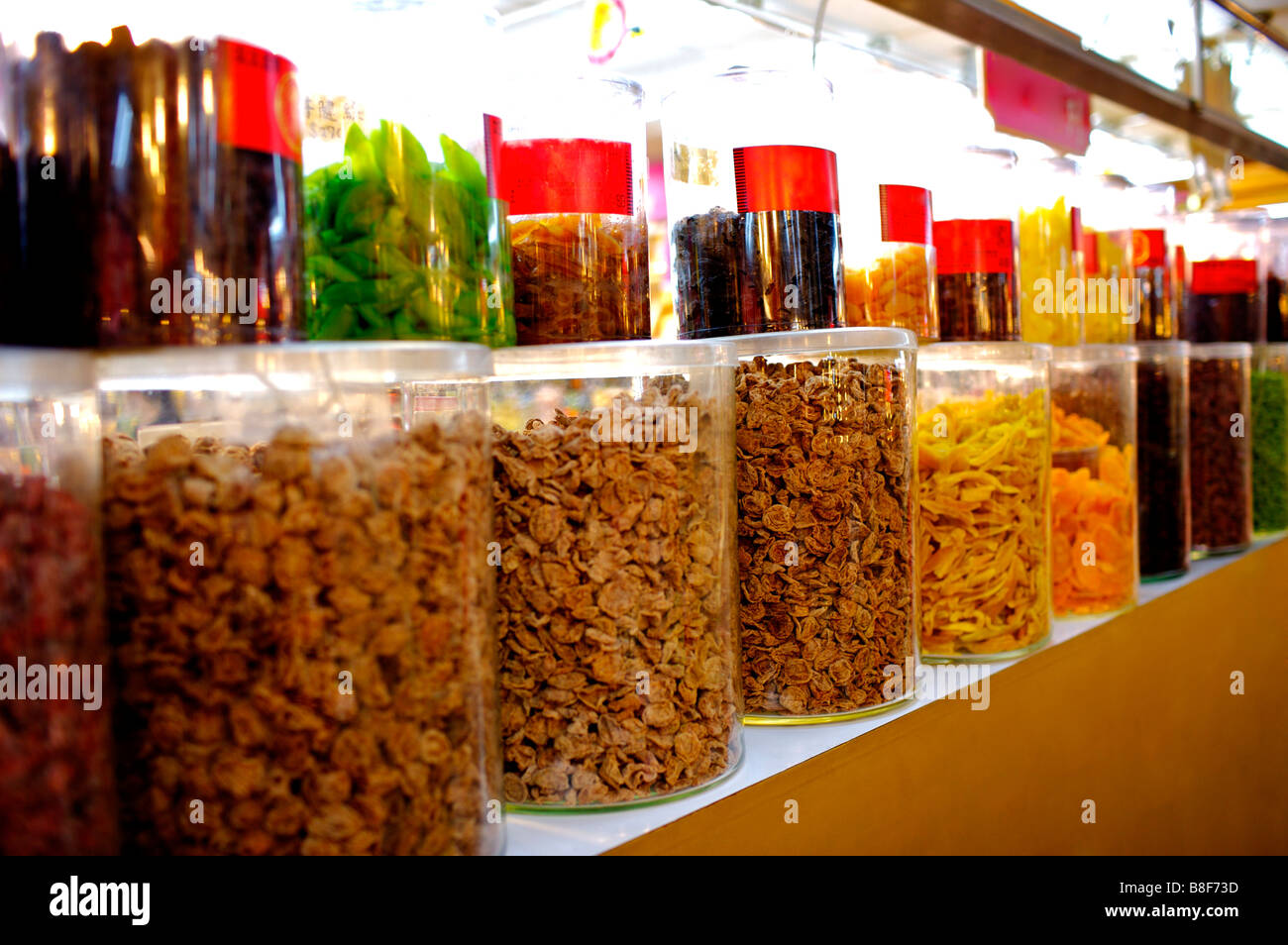 Dried goods in jars on display in a store Stock Photo - Alamy