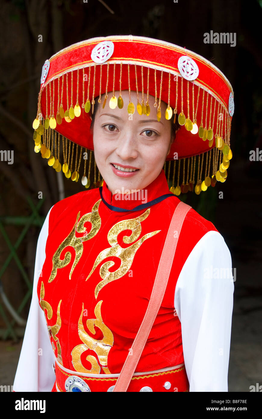 Asia, China, Yunnan Province. Young Yi minority woman in traditional ...