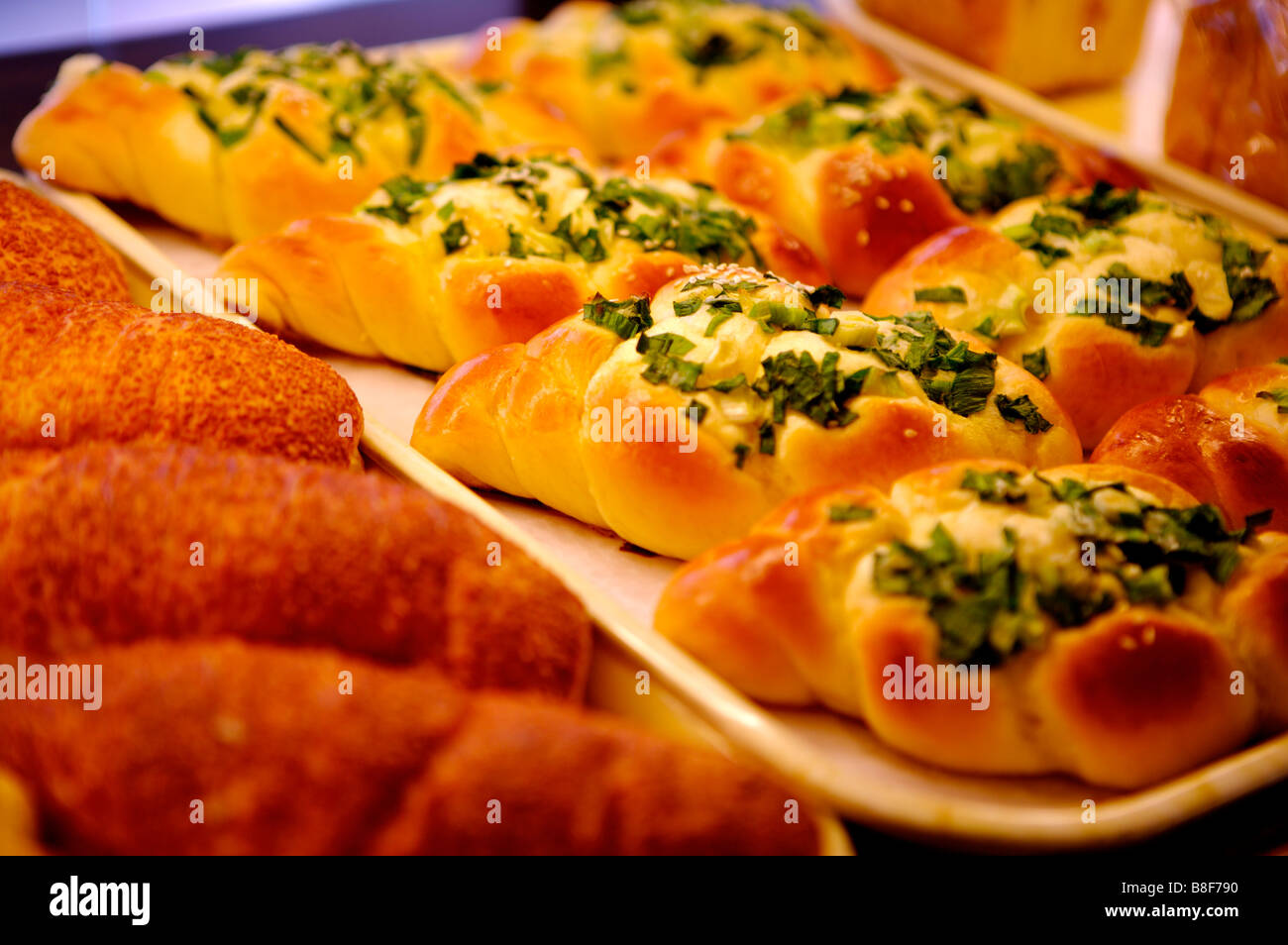 Two trays of fresh bread on display Stock Photo - Alamy