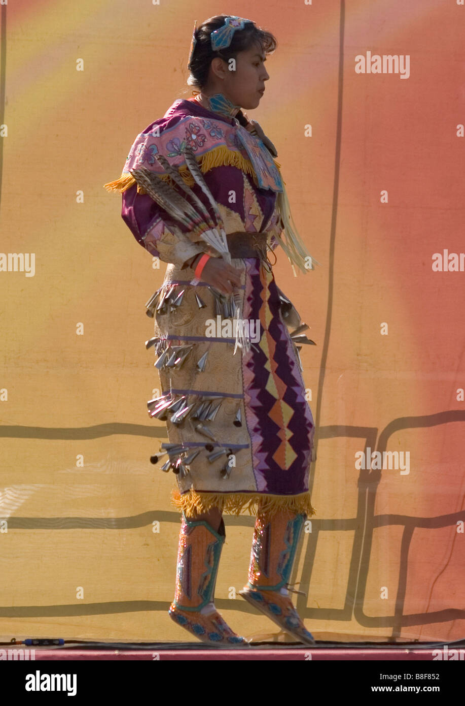 Member of native American dance troupe that performs Native American ...
