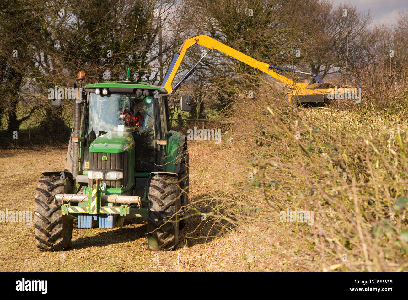 A tractor mechanically Hedge Trimming Stock Photo - Alamy