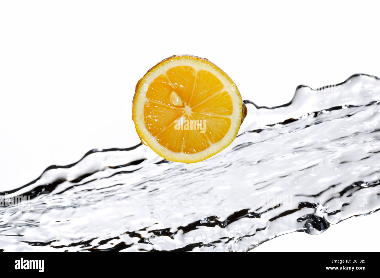 Cross section of an orange in a stream of flowing water Stock Photo - Alamy