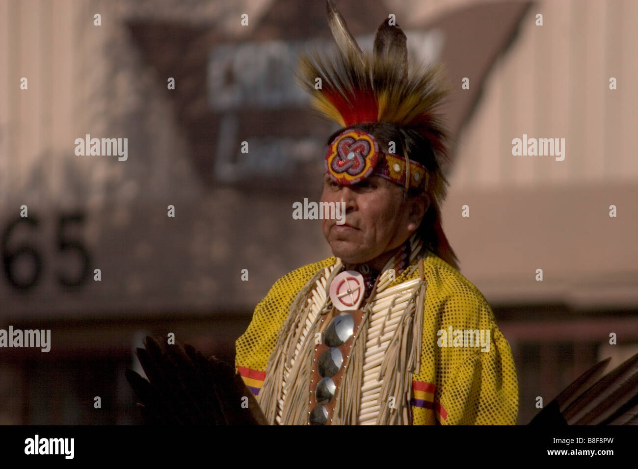 Member of native American dance troupe that performs Native American ...