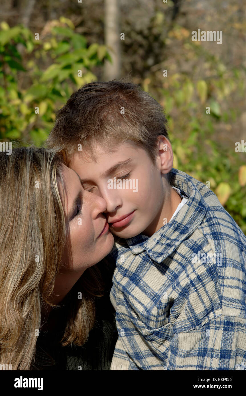 Mother hugging son Stock Photo - Alamy