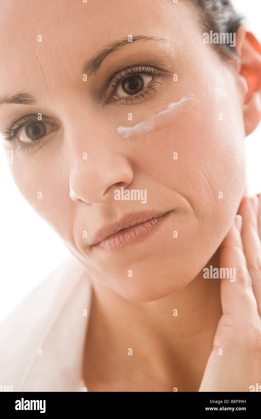 woman with eye cream Stock Photo - Alamy