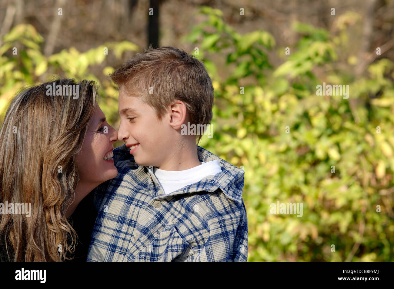 Woman and boy rubbing each others nose Stock Photo - Alamy